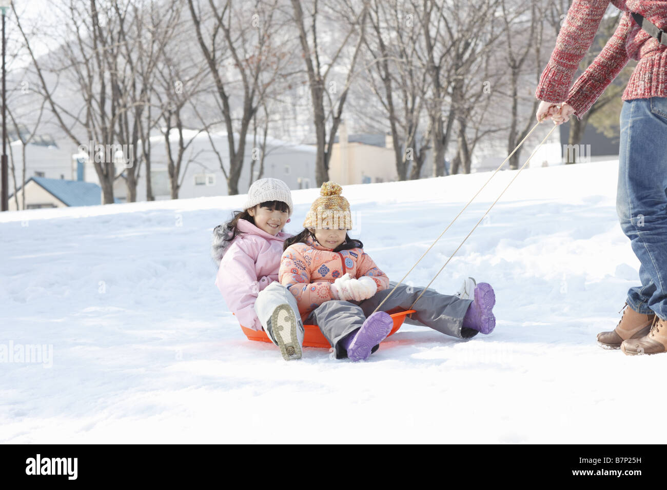 Children at play sledding Stock Photo - Alamy