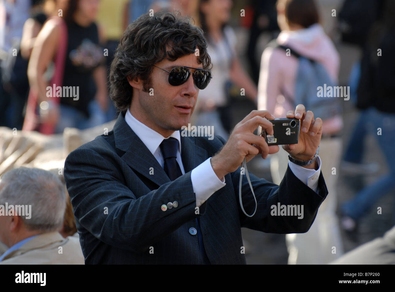 Male taking a photograph with digital camera Rome Stock Photo - Alamy