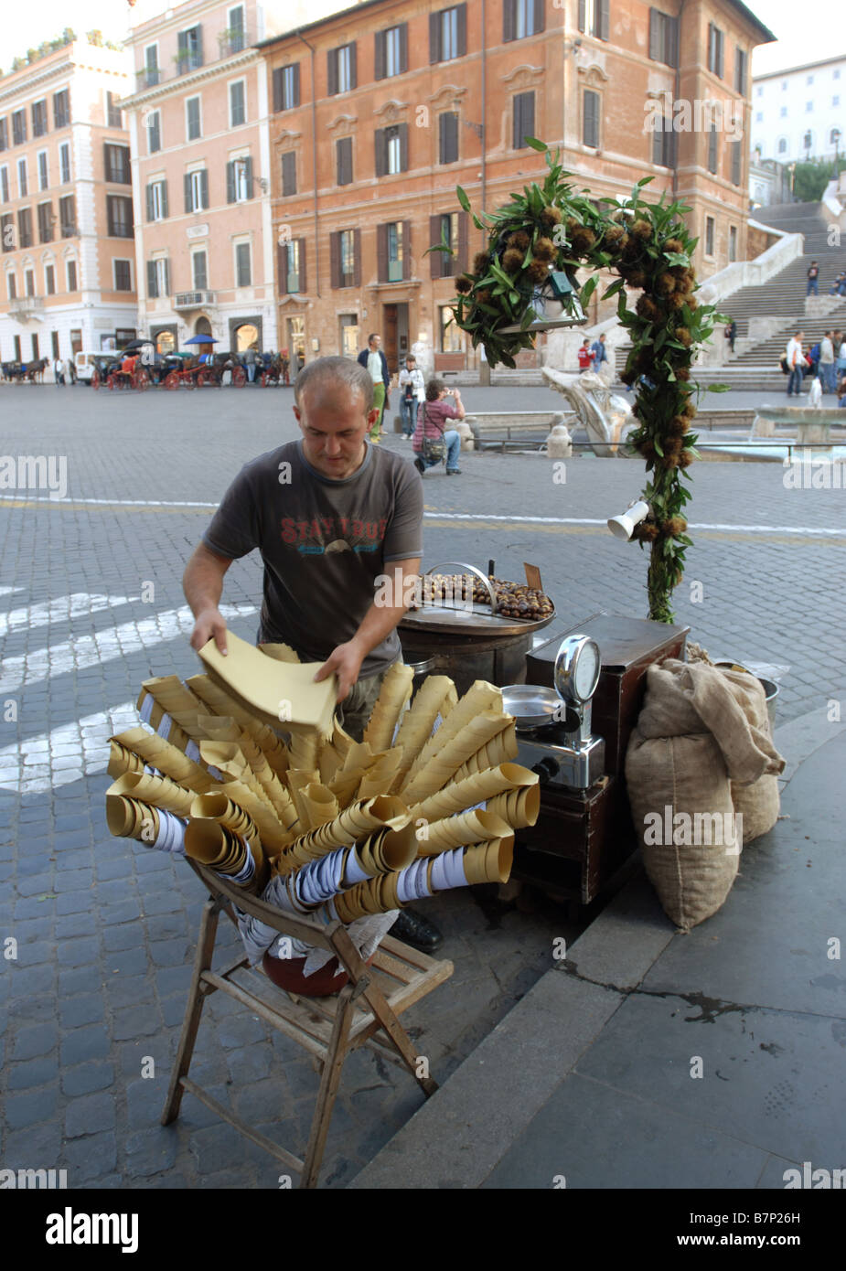 Man selling hot nuts on the street in front of the Spanish Steps Rome ...