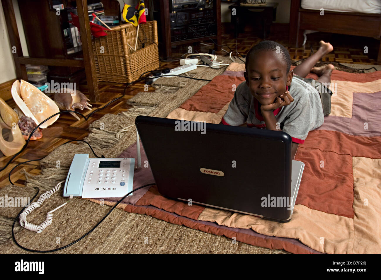 A child enjoying the internet at home Nairobi Kenya Stock Photo - Alamy