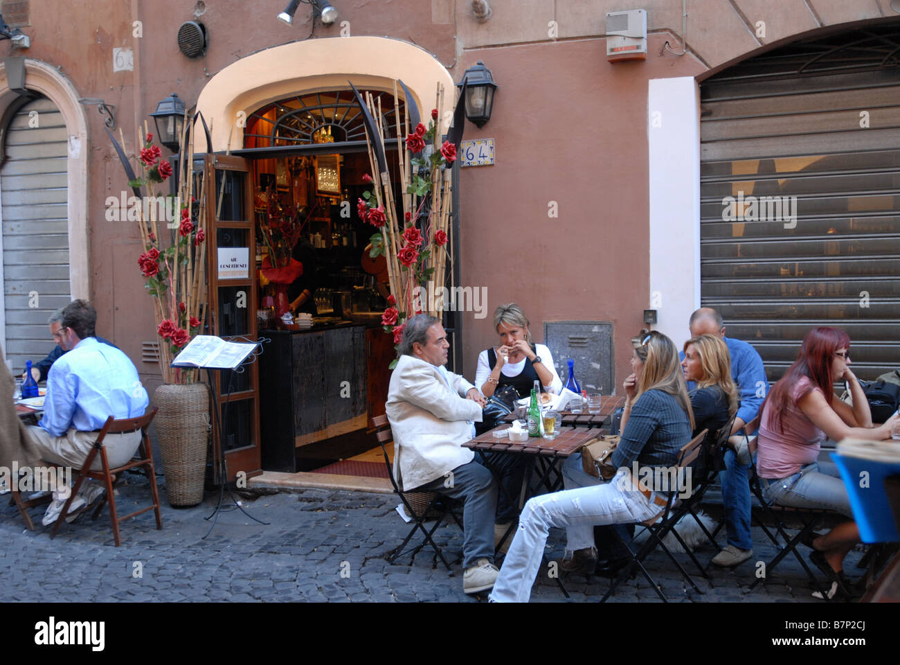 Locals having lunch on a pavement cafe on a side street in Rome October ...