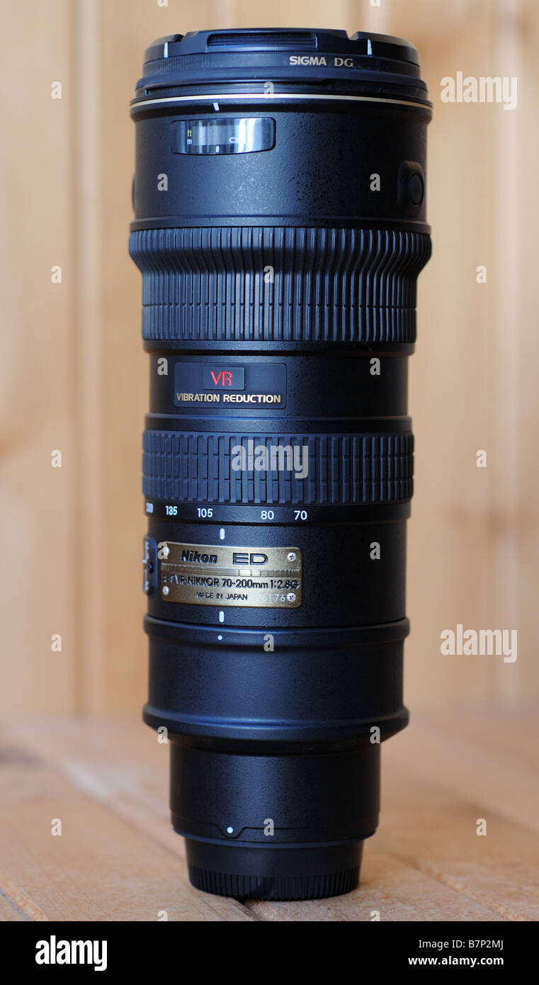 A Nikon lens, 70 200 zoom 2.8 VR Vibration reduction, with a wood ...