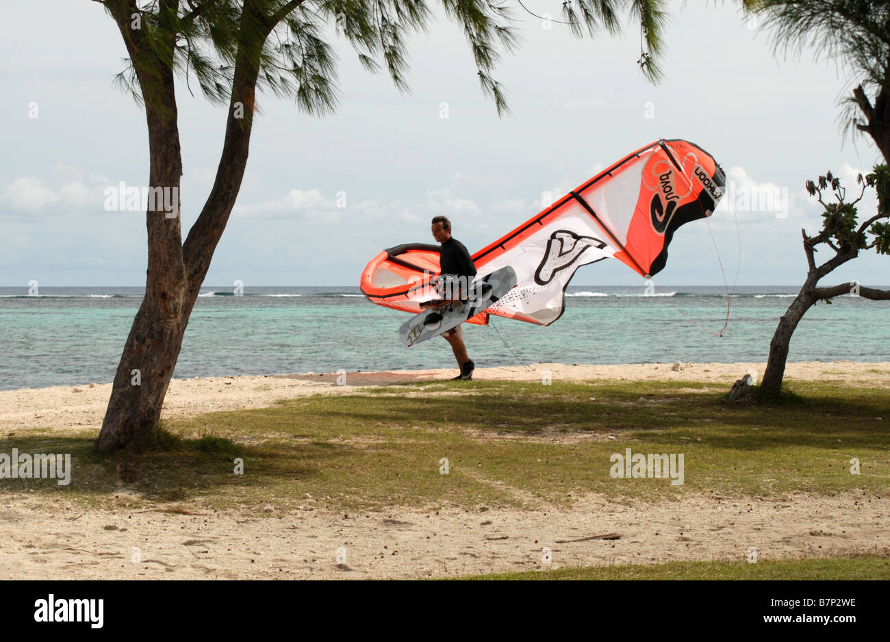 Wind surfer walking on the Beach on the Isle of Mauritius Stock Photo ...