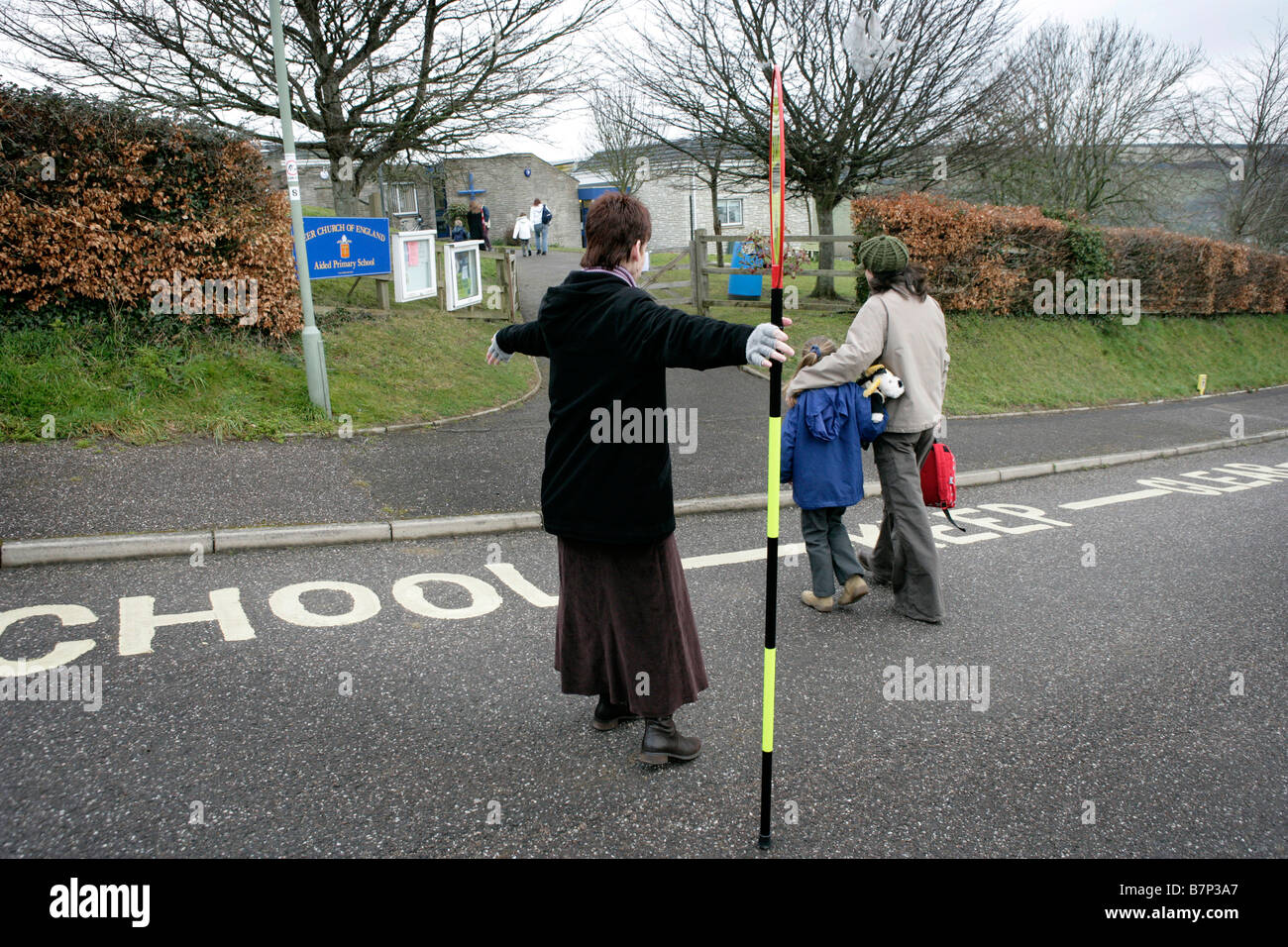 school crossing patrol outside primary school Stock Photo - Alamy