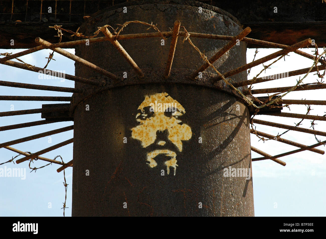 A face representing Jesus Christ spray painted on the rusty remains of ...