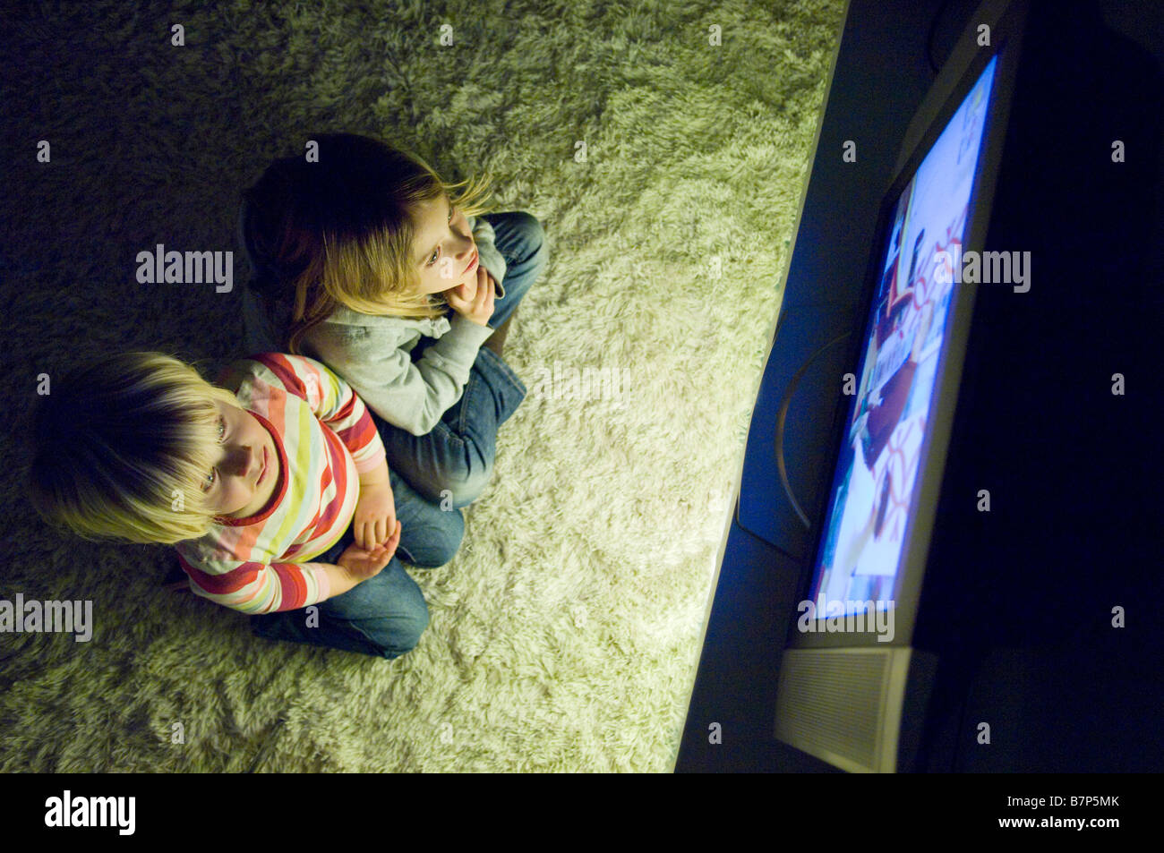 Child portrait watch tv television hi-res stock photography and images ...