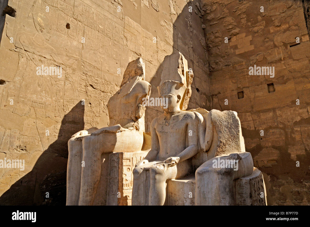 Pharaoh and his Queen statues in the Temple Complex at Luxor in Egypt ...