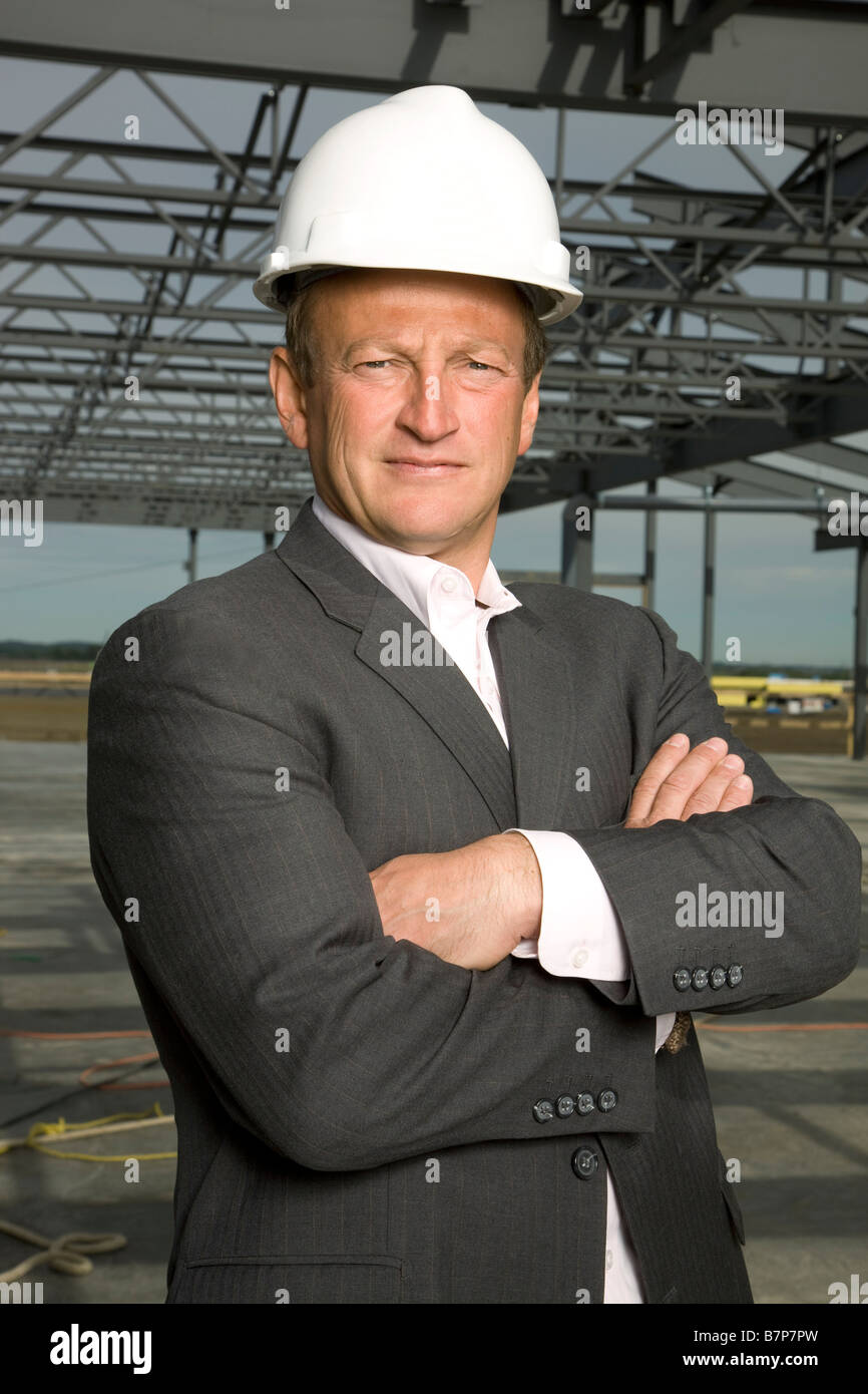Businessman at a new building Stock Photo - Alamy
