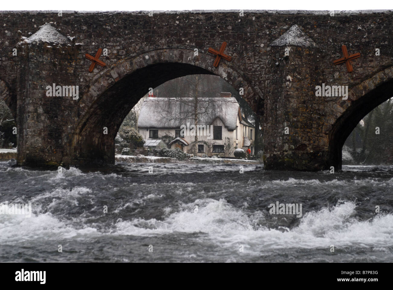 An unusual view of a riverside cottage in Bickleigh through an arch on ...