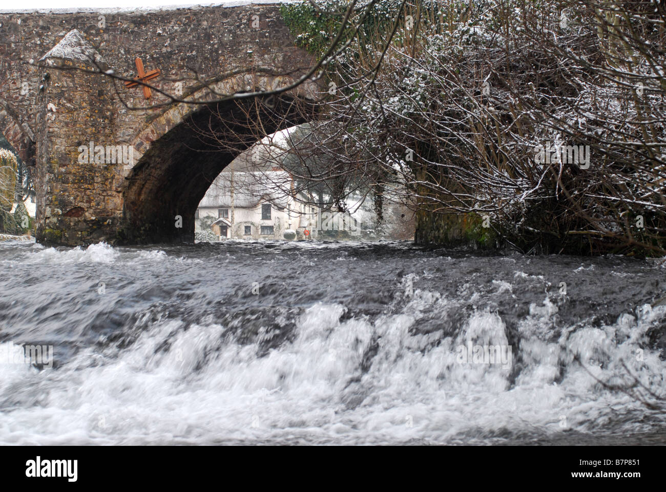 An unusual view of a riverside cottage in Bickleigh through an arch on ...