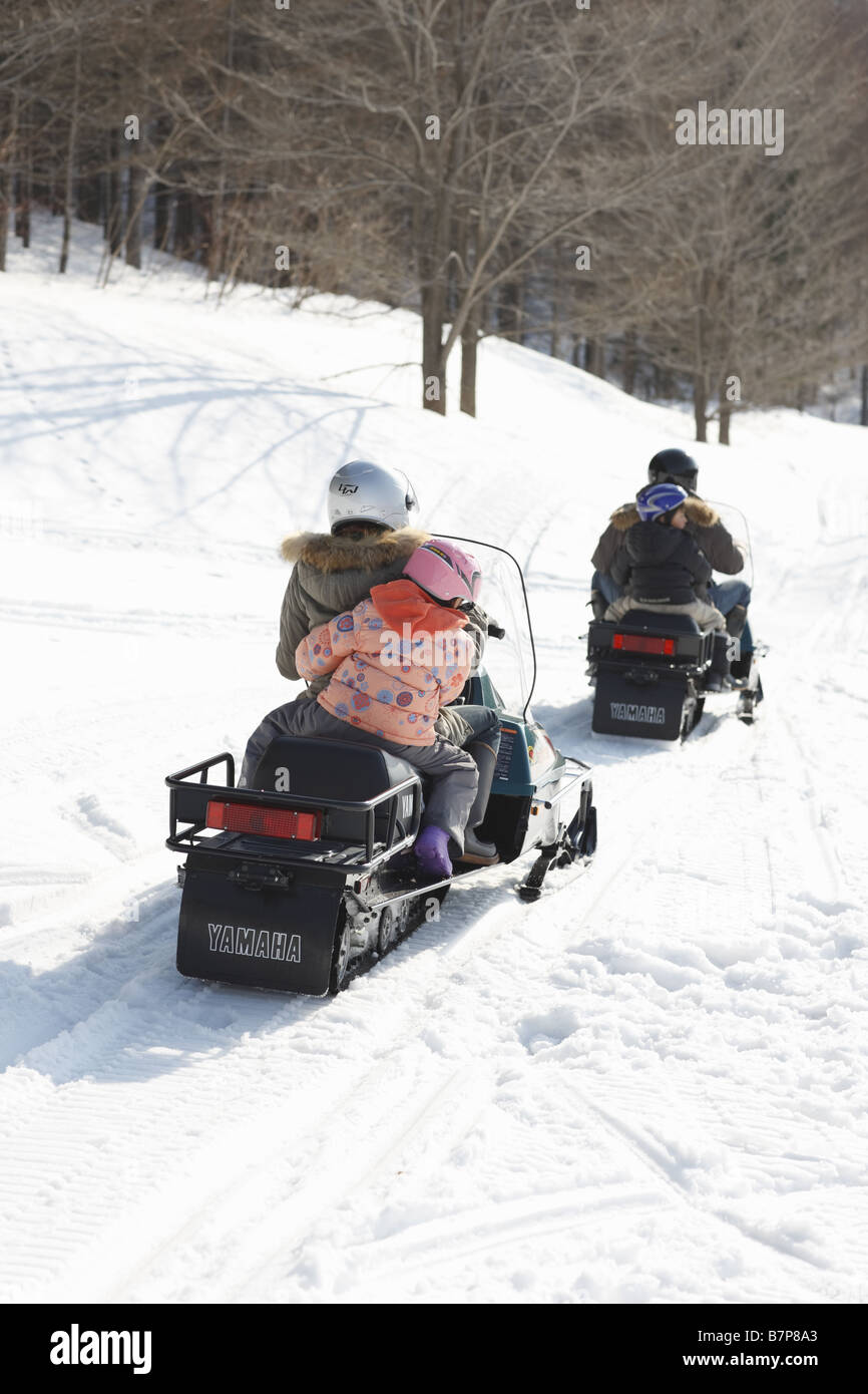 Two people riding snowmobile hi-res stock photography and images - Alamy