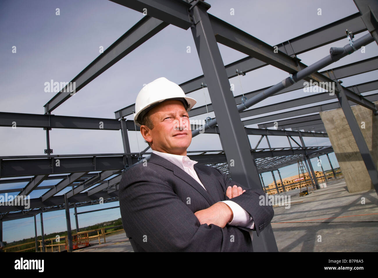Businessman in front of building Stock Photo - Alamy