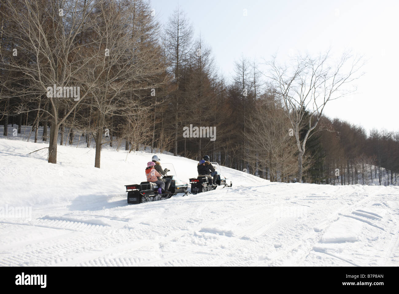 Two people riding snowmobile hi-res stock photography and images - Alamy