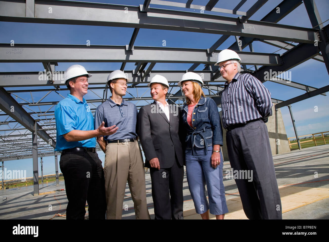 Group of people in front of building Stock Photo - Alamy