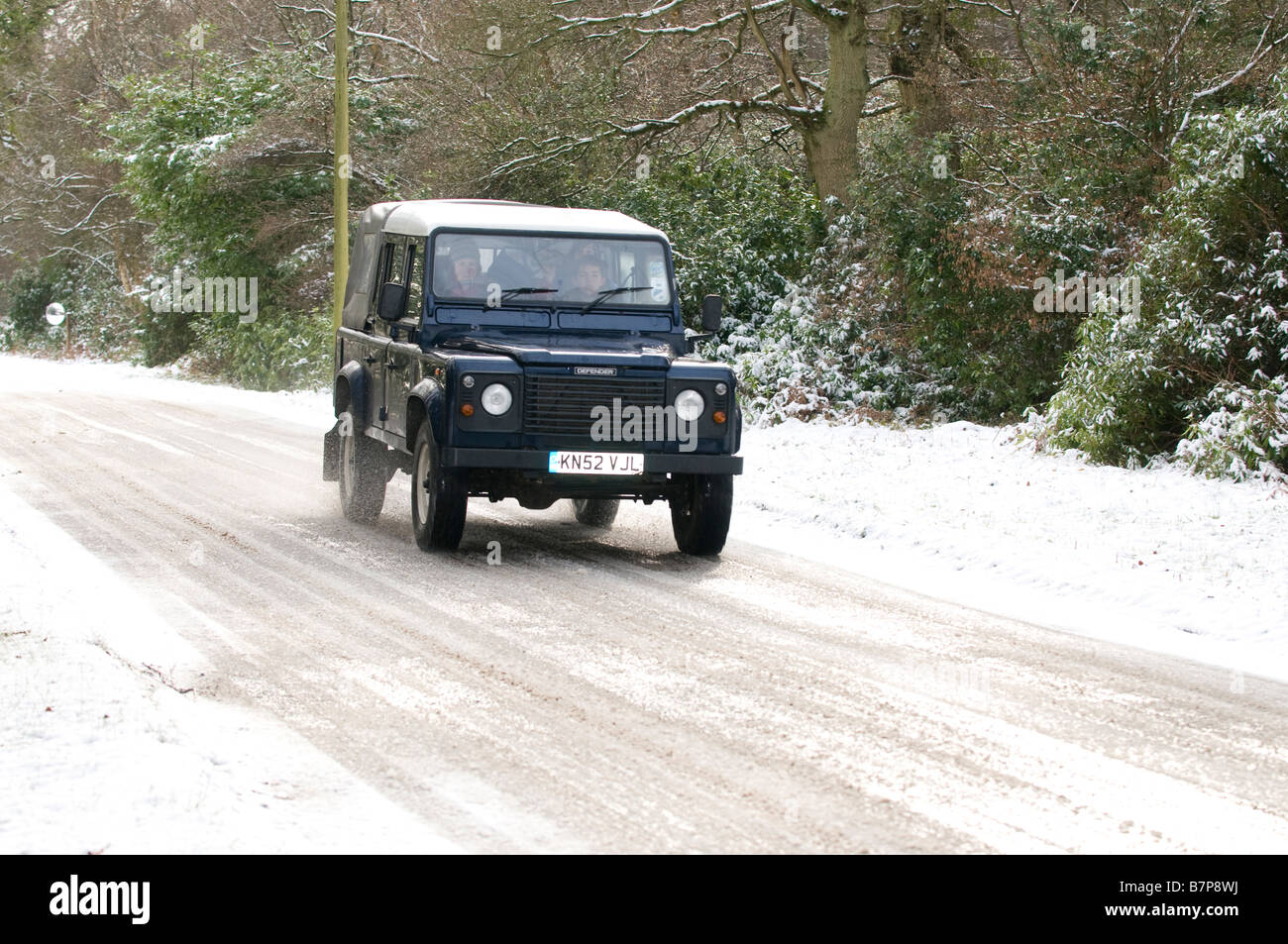 2002 Land Rover Defender driving on snow, 2009 Stock Photo - Alamy