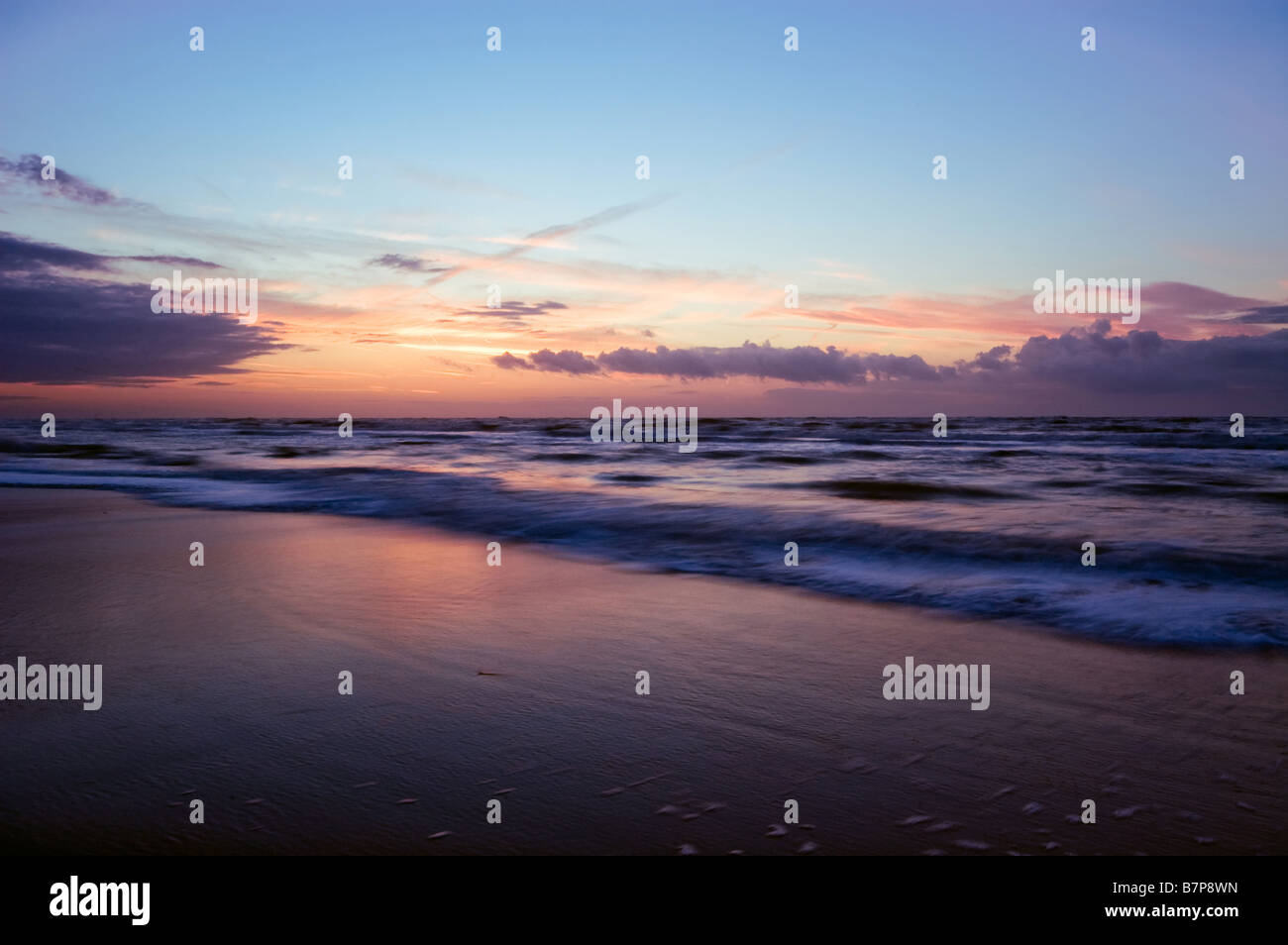 sunset on the beach in holland the netherlands Stock Photo - Alamy