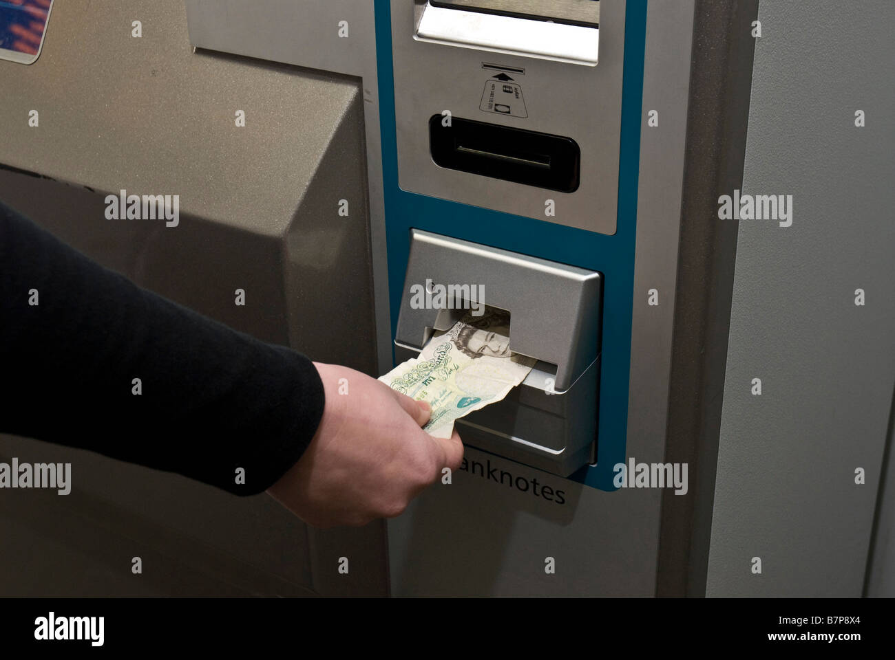 Inserting a Five Pound Note into a Rail Ticket Vending Machine Stock ...