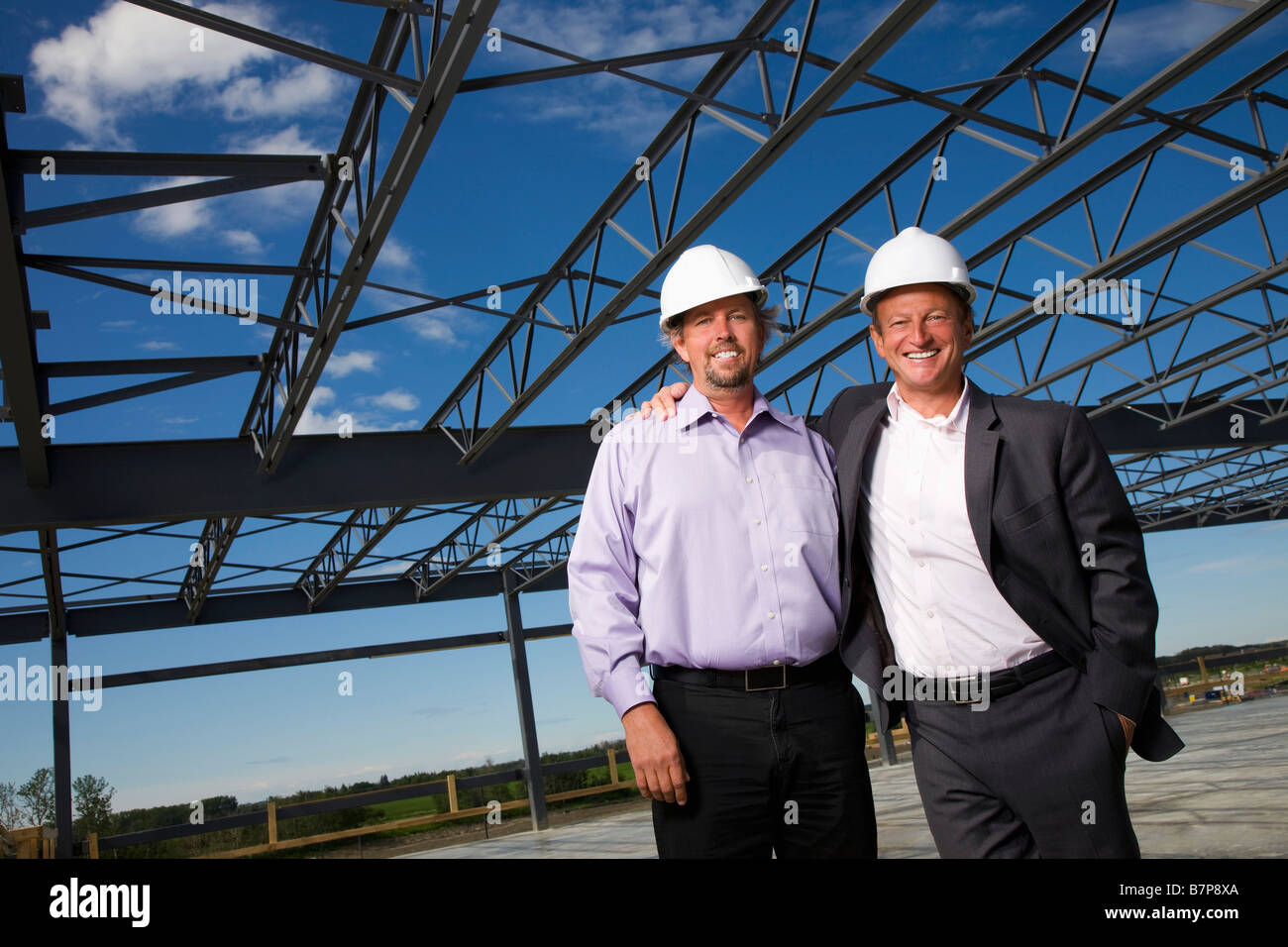 Two architects in front of a building Stock Photo - Alamy