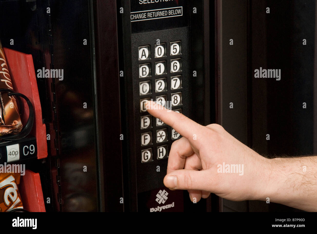 Choosing Product from a Vending Machine Stock Photo - Alamy