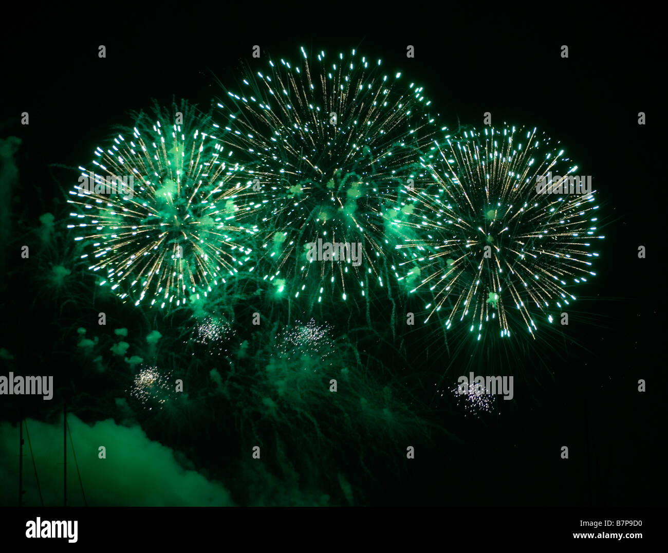 Fireworks exploding with green colors Stock Photo - Alamy