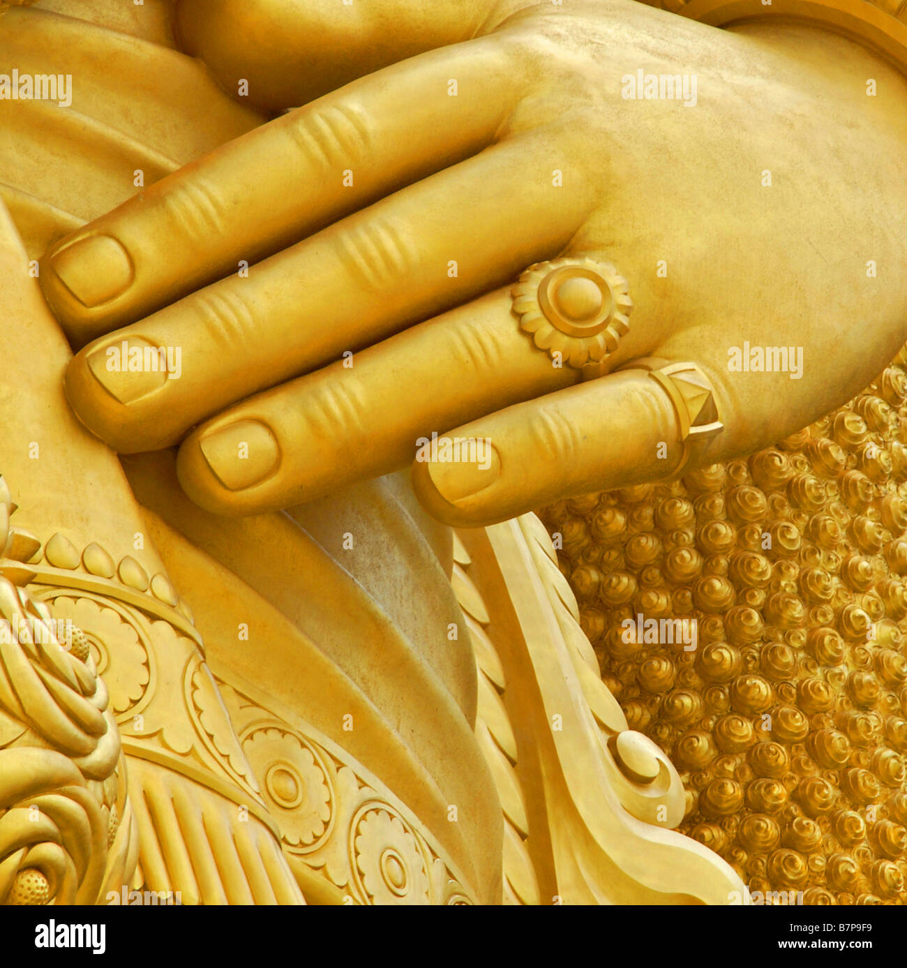 Gold plated fingers of buddha statue hi-res stock photography and ...