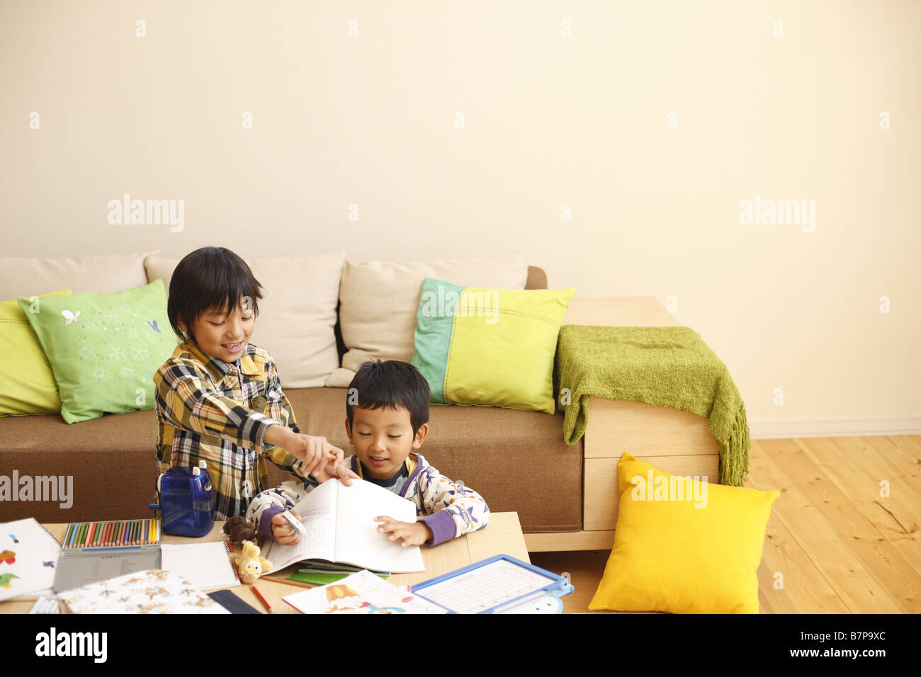 Brothers doing homework Stock Photo - Alamy