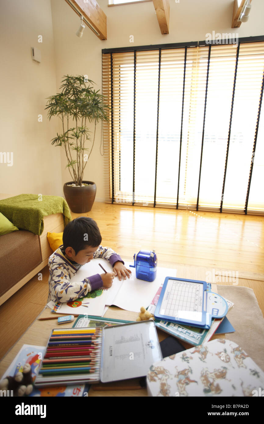 A boy doing homework Stock Photo - Alamy