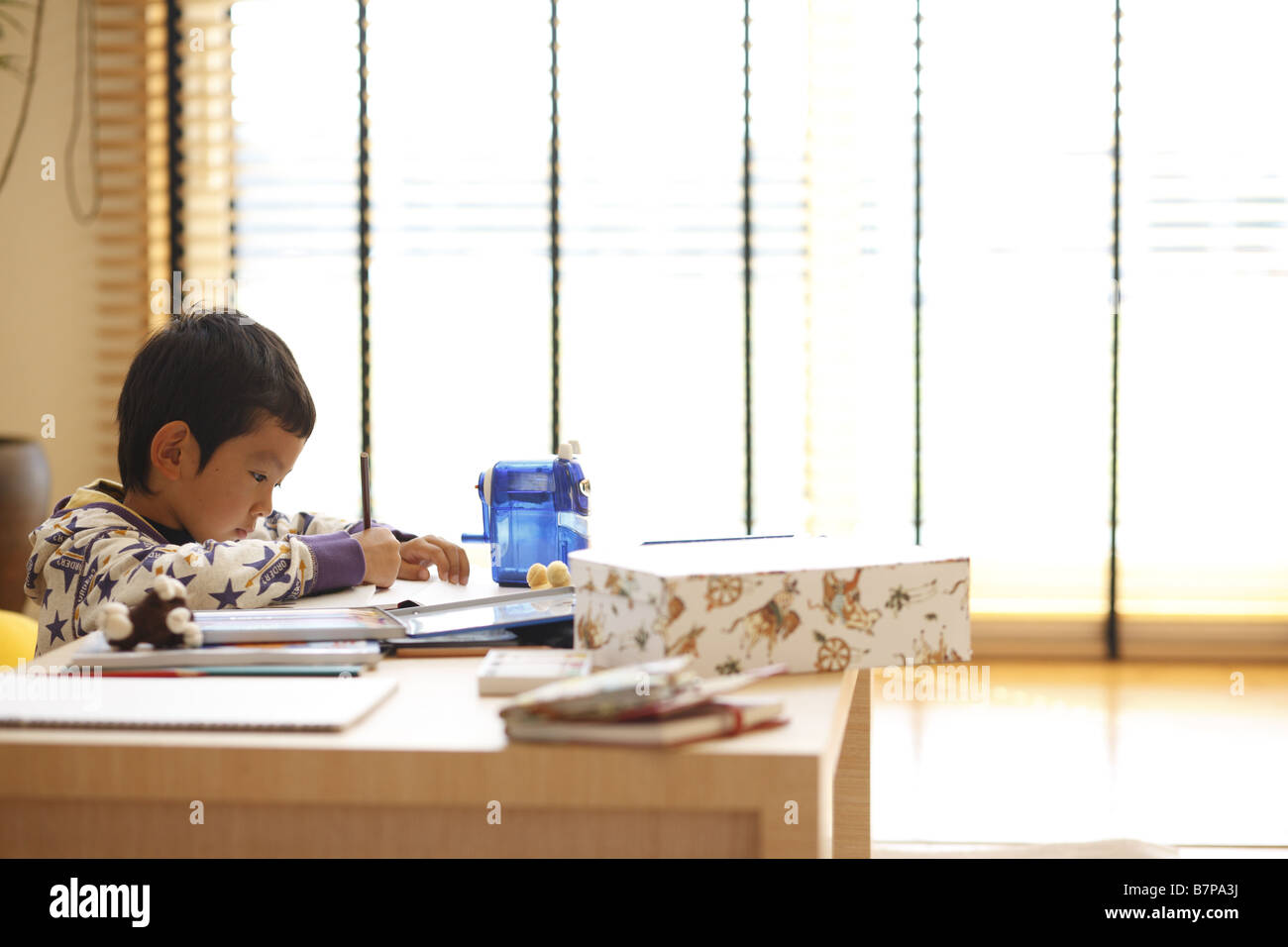 A boy doing homework Stock Photo - Alamy