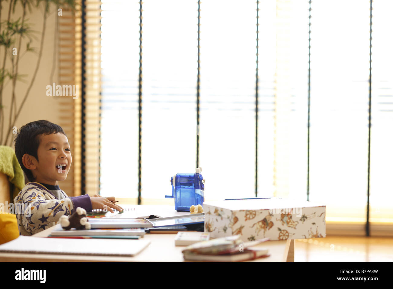 A boy doing homework Stock Photo - Alamy