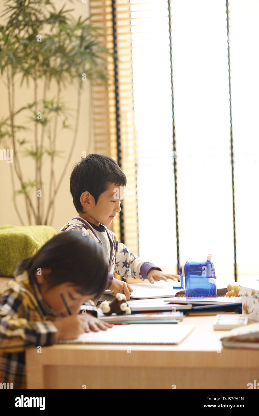Boys doing homework Stock Photo - Alamy