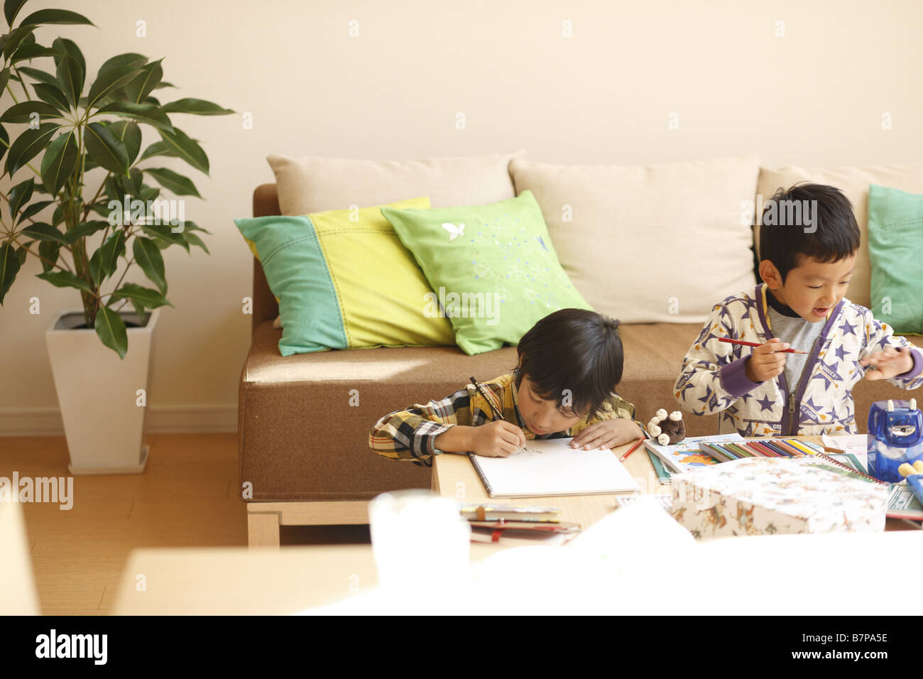 Two brothers doing homework hi-res stock photography and images - Alamy