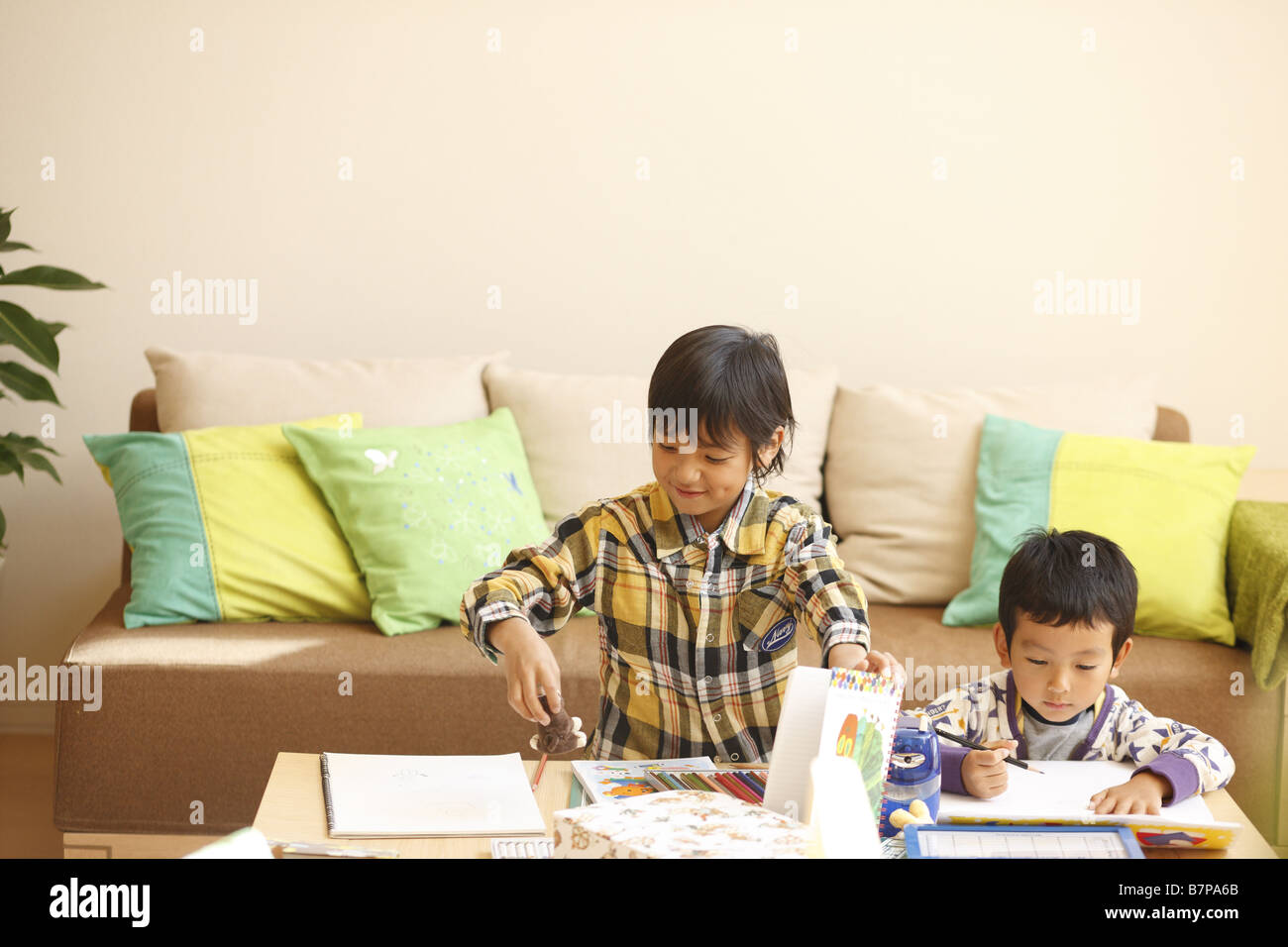 Boys doing homework Stock Photo - Alamy