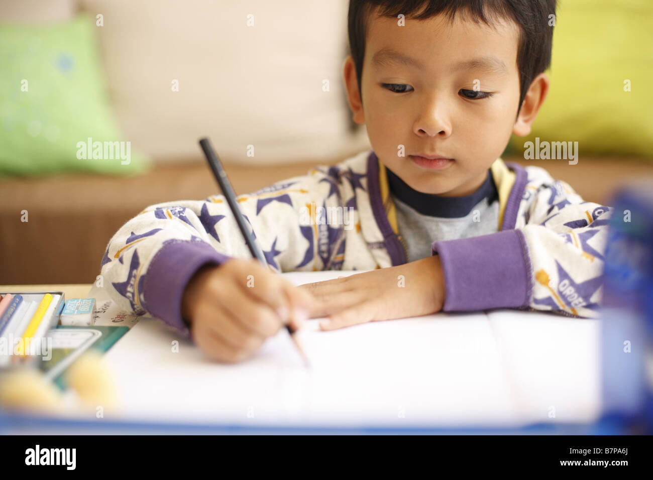 A boy doing homework Stock Photo - Alamy