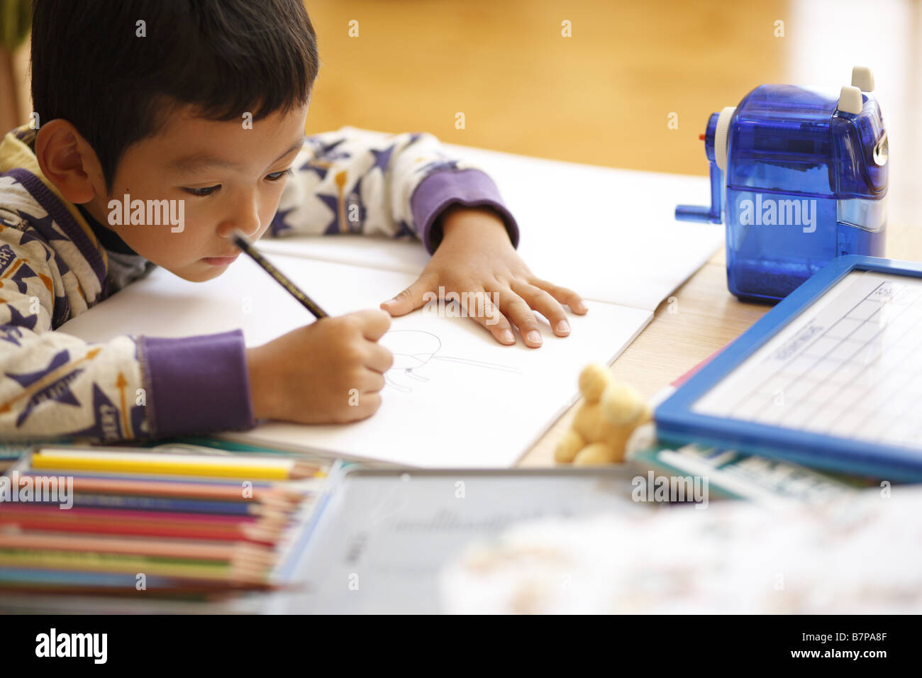 A boy doing homework Stock Photo - Alamy