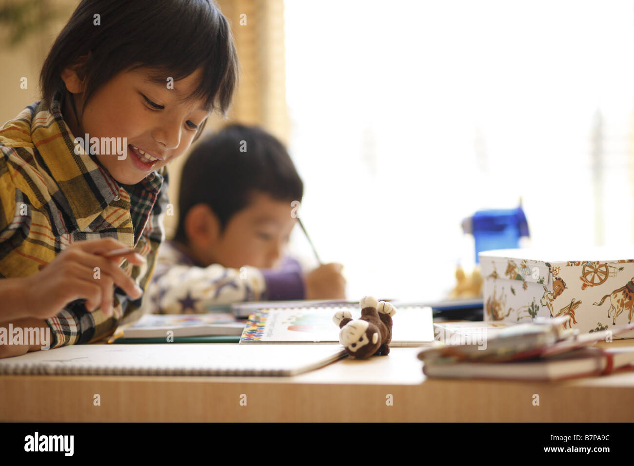 Boys doing homework Stock Photo - Alamy
