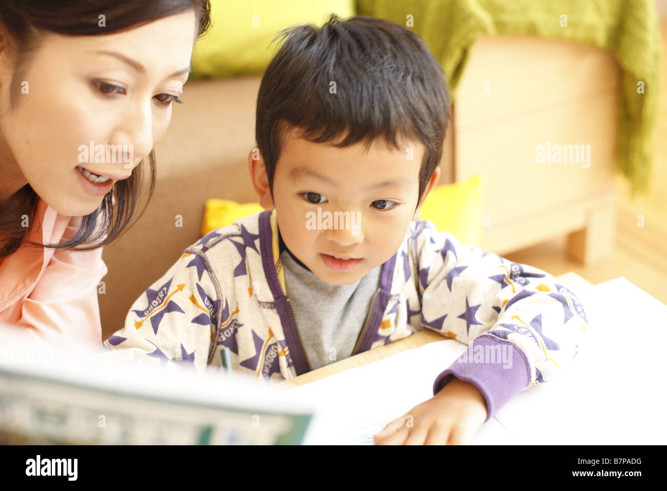 Mother and child studying Stock Photo - Alamy
