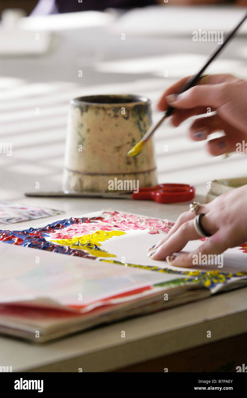 girl painting in secondary school art lesson Stock Photo - Alamy