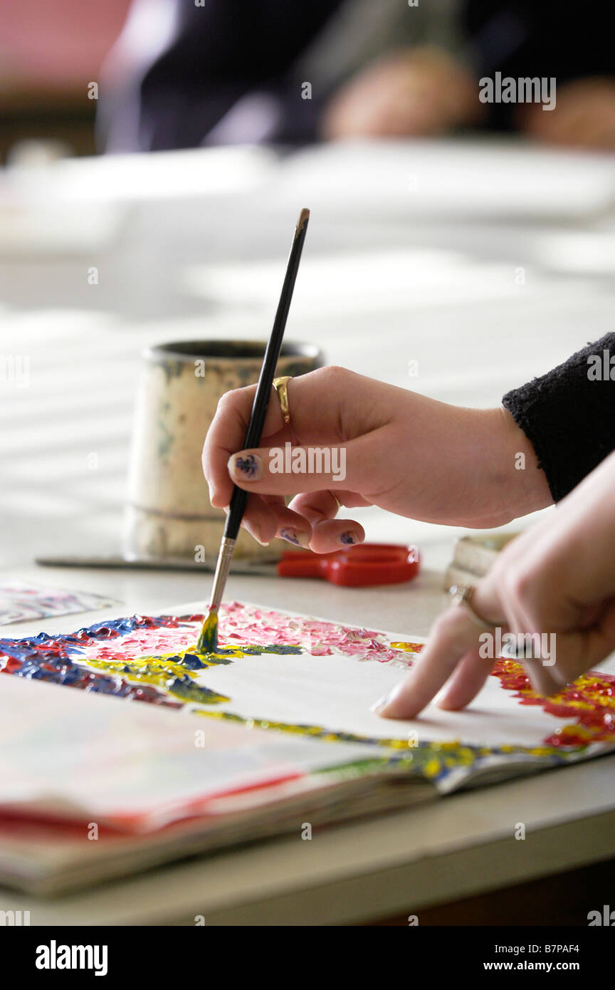 girl painting in secondary school art lesson Stock Photo - Alamy