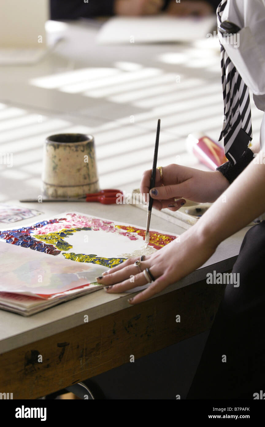 girl painting in secondary school art lesson Stock Photo - Alamy