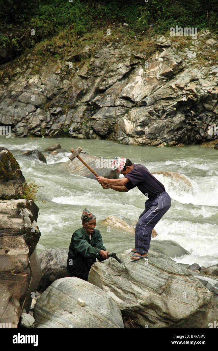 Men breaking rocks hi-res stock photography and images - Alamy