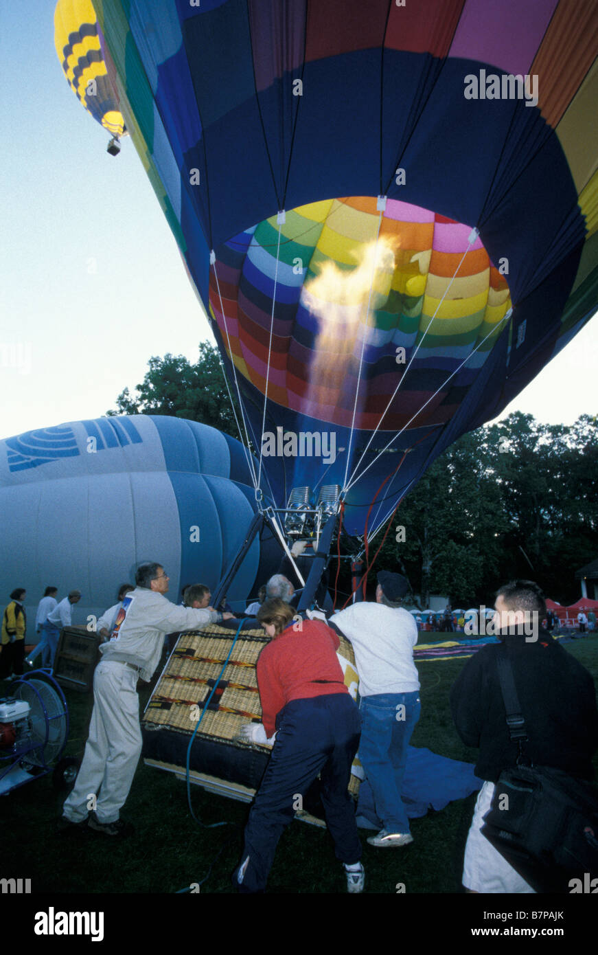 Crew Restraining Hot Air Balloon ready To Launch with Burners On Stock ...