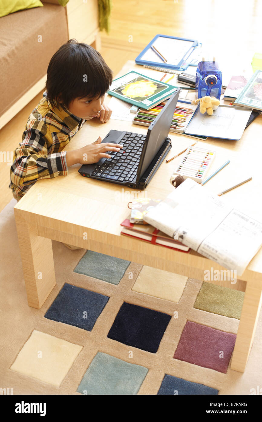 A boy using laptop Stock Photo - Alamy