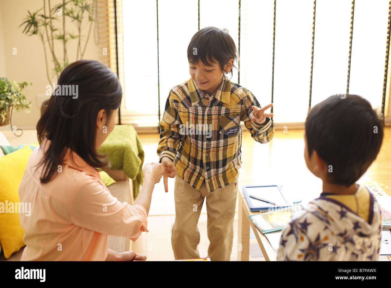 Children playing rock, paper, scissors hi-res stock photography and ...