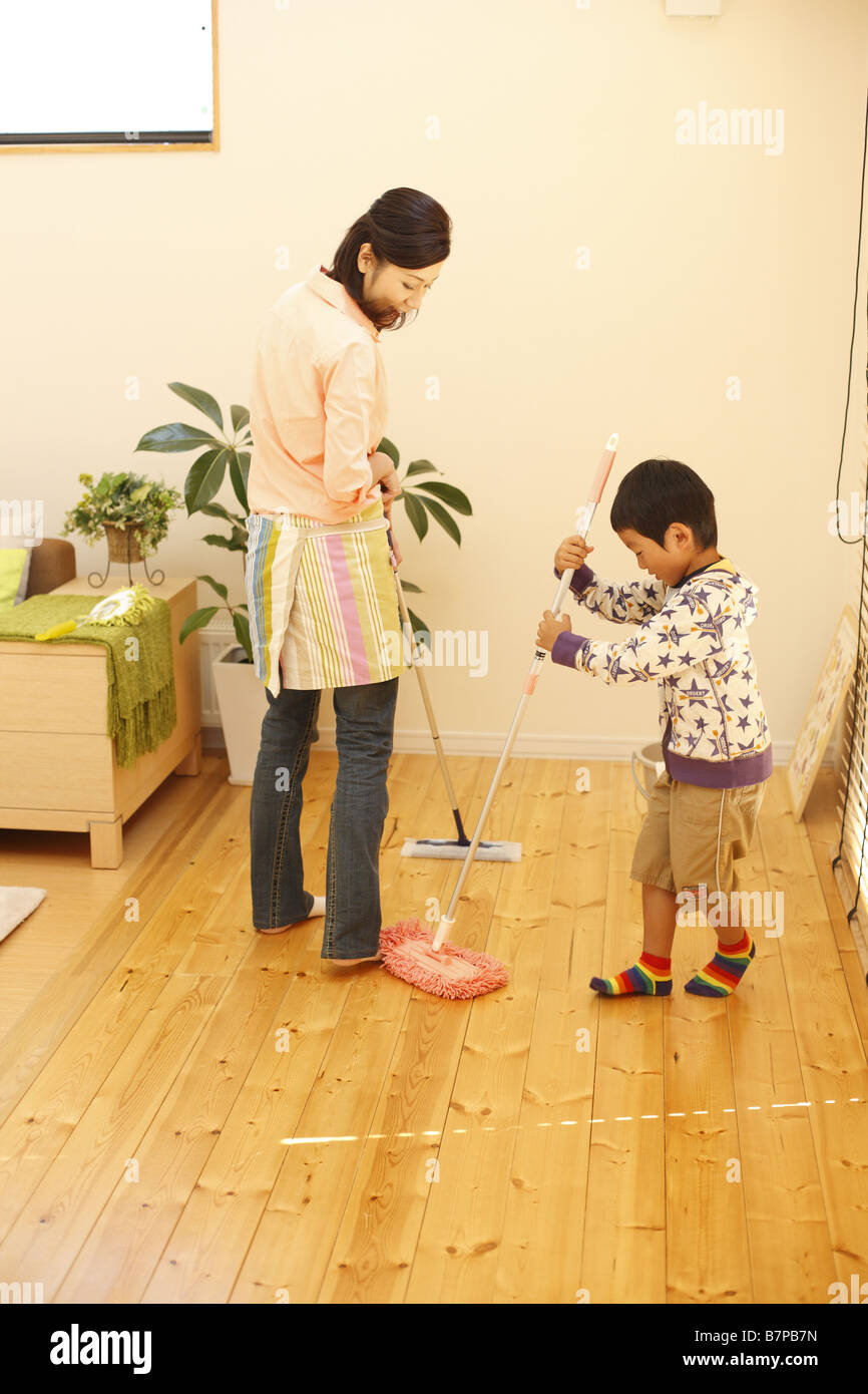 Mother and child cleaning Stock Photo - Alamy