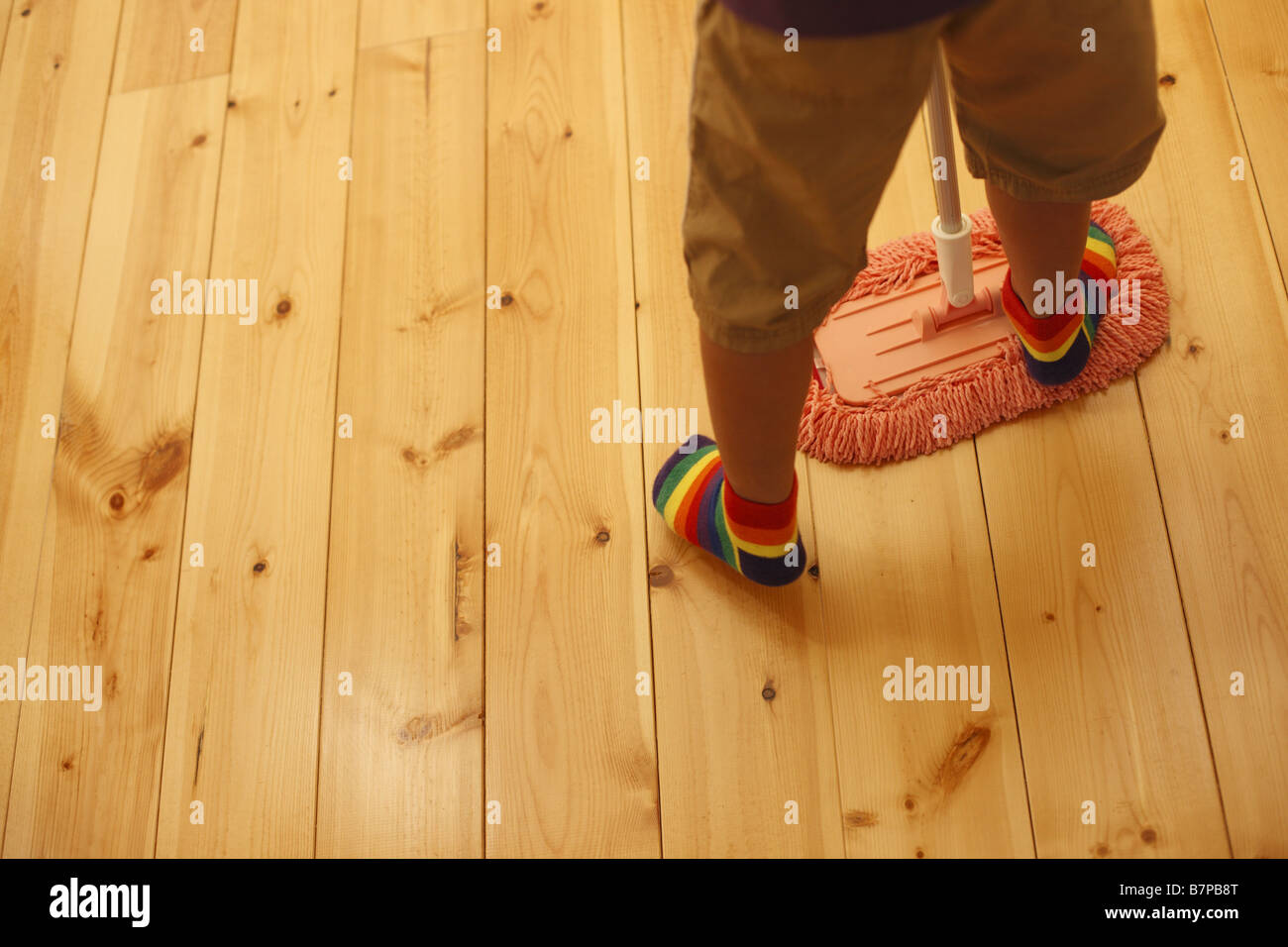 Legs of boy cleaning Stock Photo - Alamy