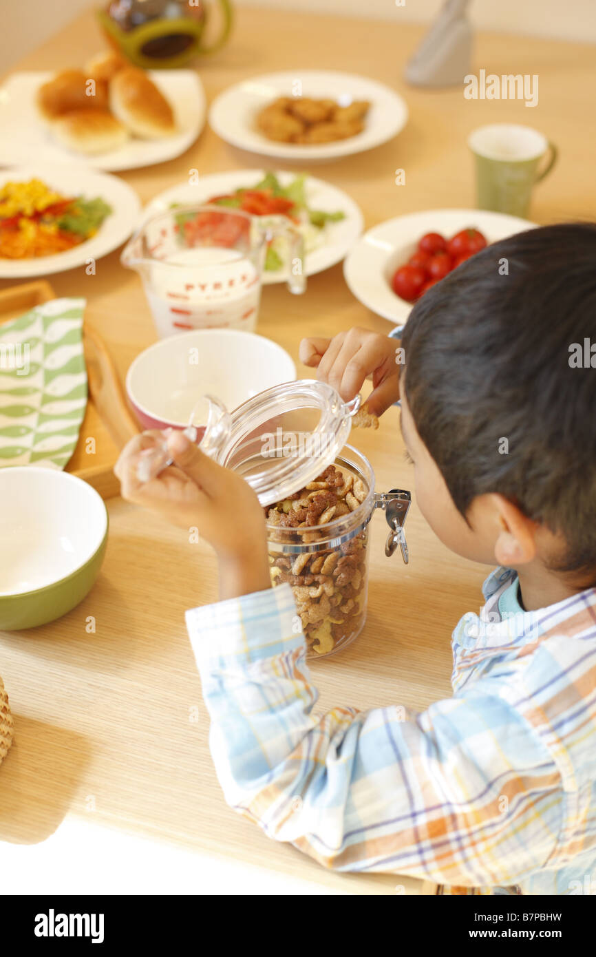 A boy eating breakfast Stock Photo - Alamy