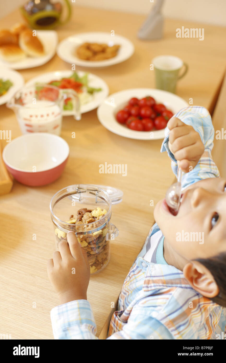 A boy having breakfast Stock Photo - Alamy