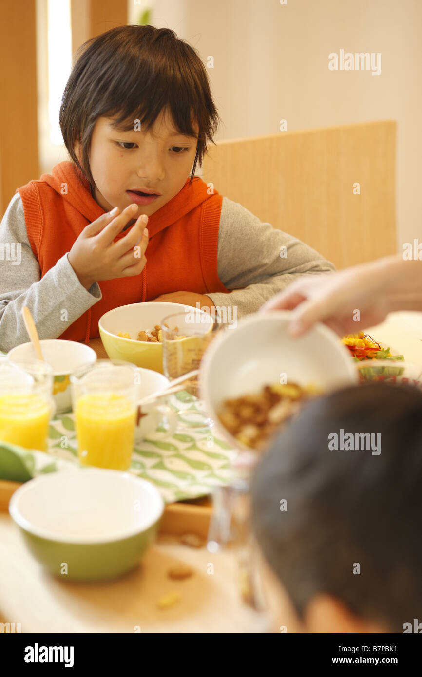 A boy having breakfast Stock Photo - Alamy