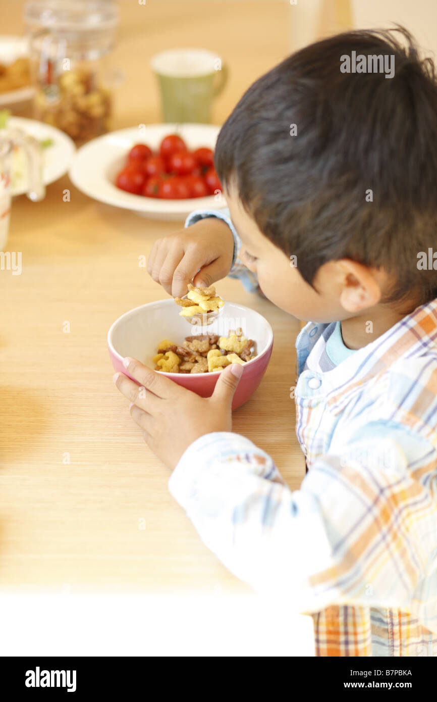 A boy having breakfast Stock Photo - Alamy