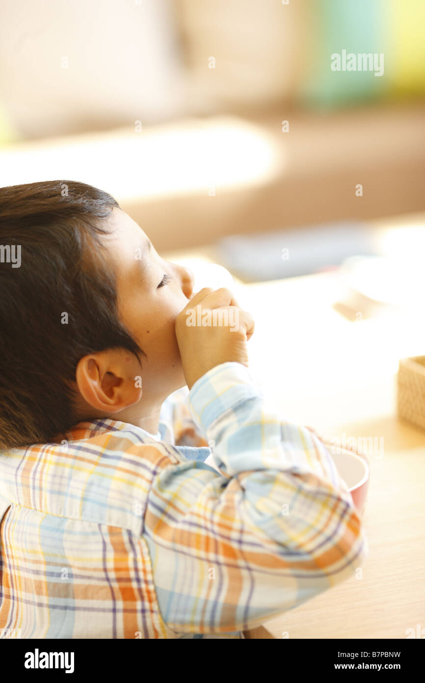 A boy having breakfast Stock Photo - Alamy